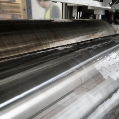 Hot Melt PUR Roll Coating System for Flat Lamination - Adhesives ...